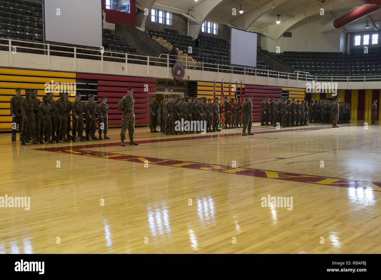 U.S. Marines with Marine Corps Installations East stand at parade rest ...