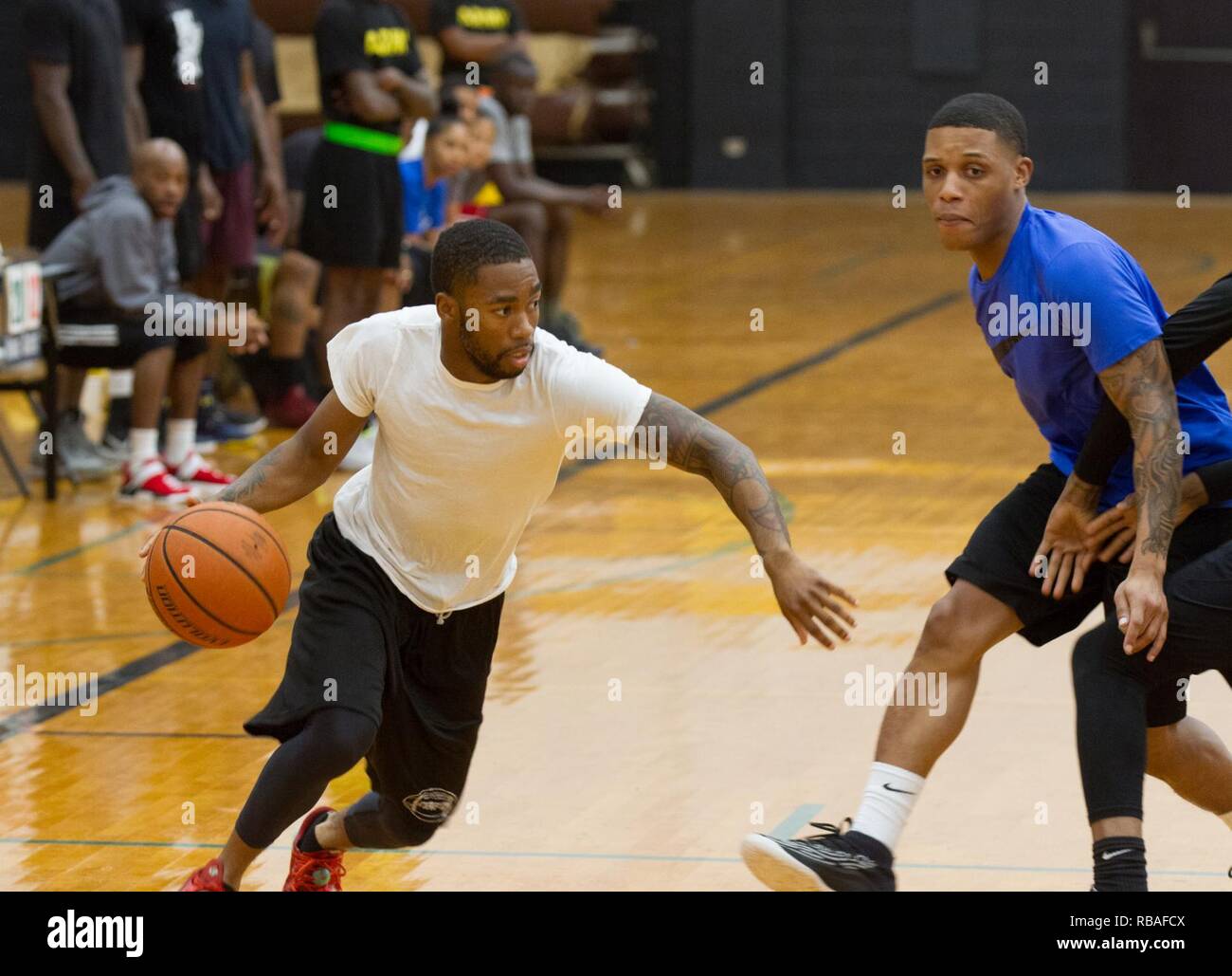 A soldier driving to the hoop, while playing basketball during Tropic ...