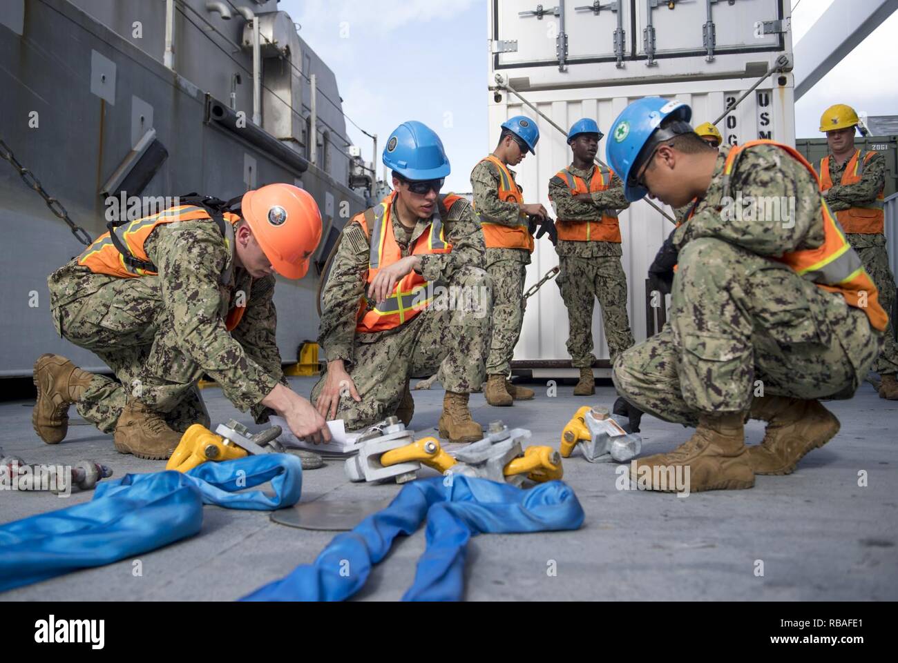 SANTA RITA, Guam (Dec. 18, 2018) Sailors assigned to Navy Cargo ...