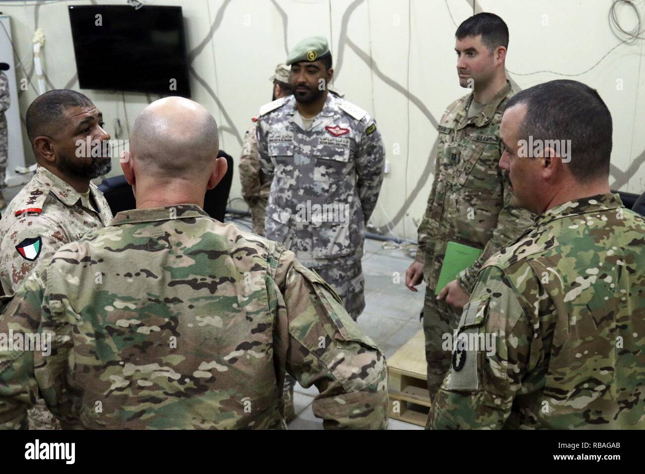 Col. Raed Al Sakran, left, of the Kuwait Land Forces, visits with ...