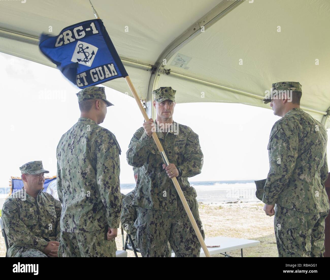 SANTA RITA, Guam, (Dec 19, 2018) Lt. Cmdr. Edward Yandoc hands off the ...