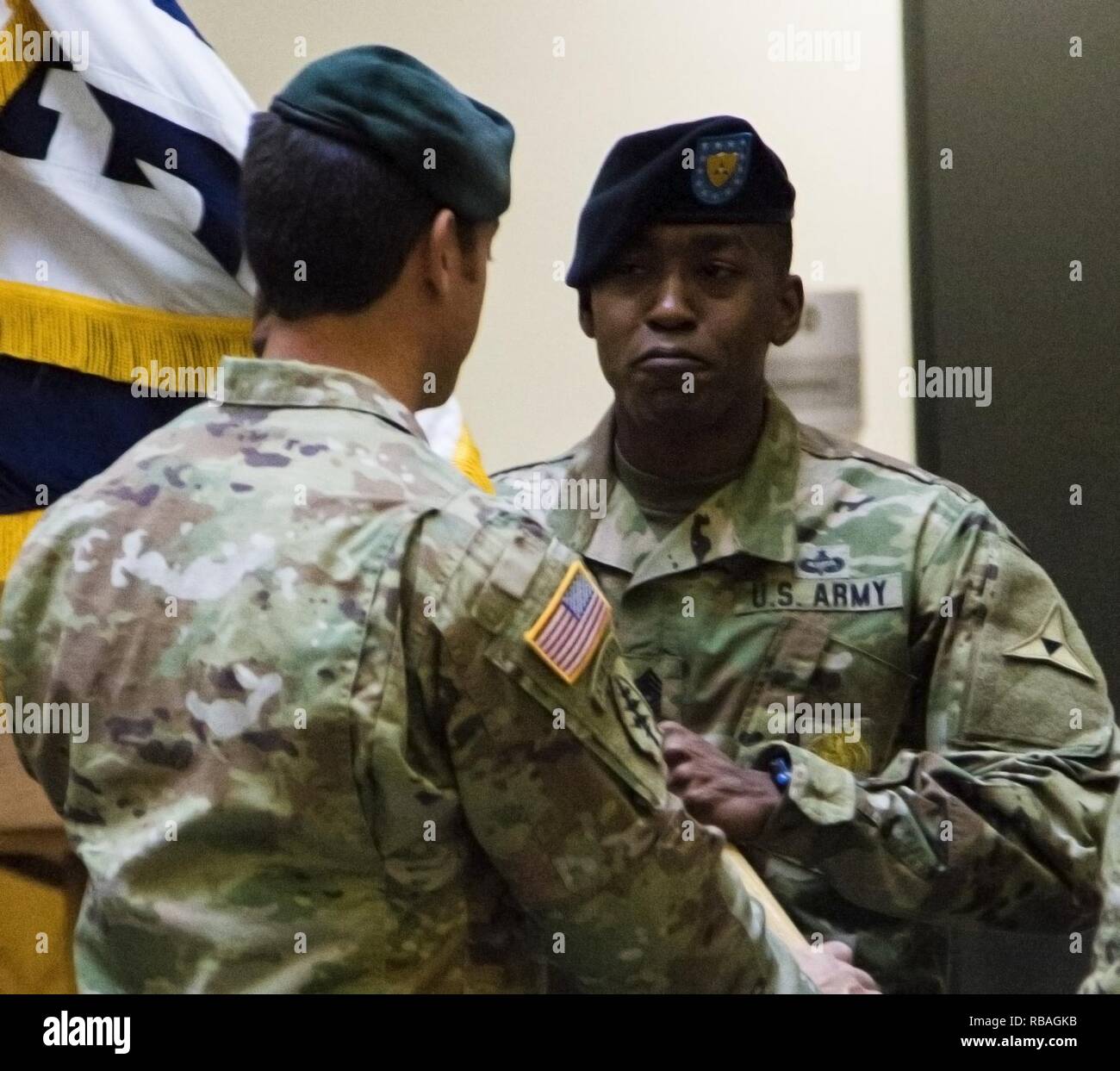 Lt. Col. Sean Hubbard passes the guidon to Command Sgt. Maj. Turner ...
