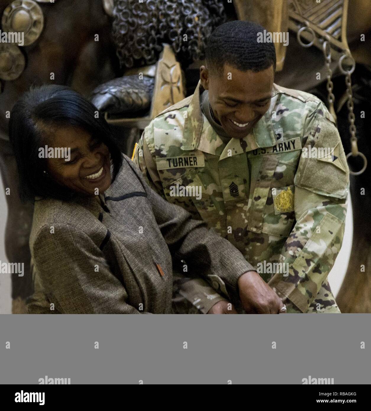 Sgt. Maj. Justin E. Turner (right) receives a lateral promotion to ...