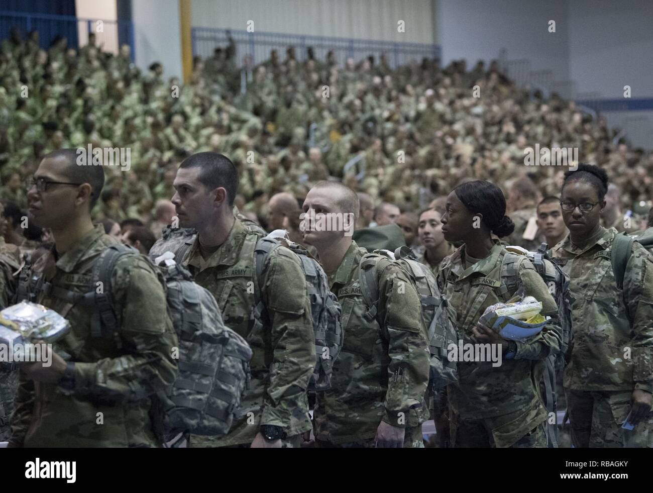 Trainees stand in line at the Solomon Center on Fort Jackson as they ...