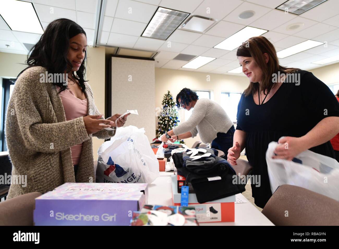 Buckley Spouses Group members ensure donated gifts meet the Angel Tree ...