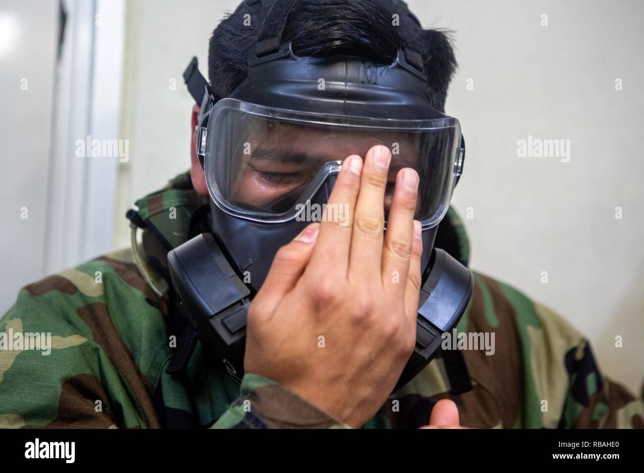 A U.S. Marine with the III Marine Expeditionary Force Information Group ...