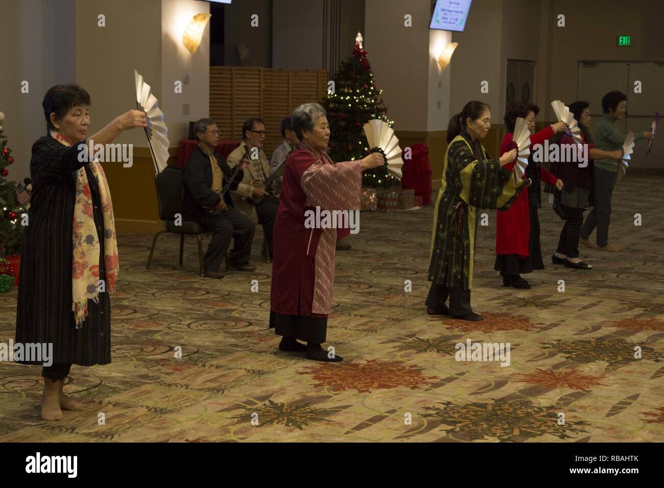 Okinawan locals perform a ceremonial dance during the Kojyu University ...