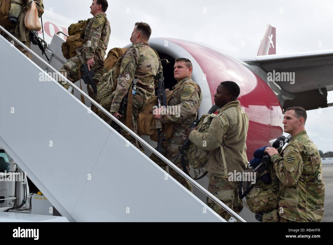 Georgia Army National Guard Soldiers board an aircraft at Hunter Army ...