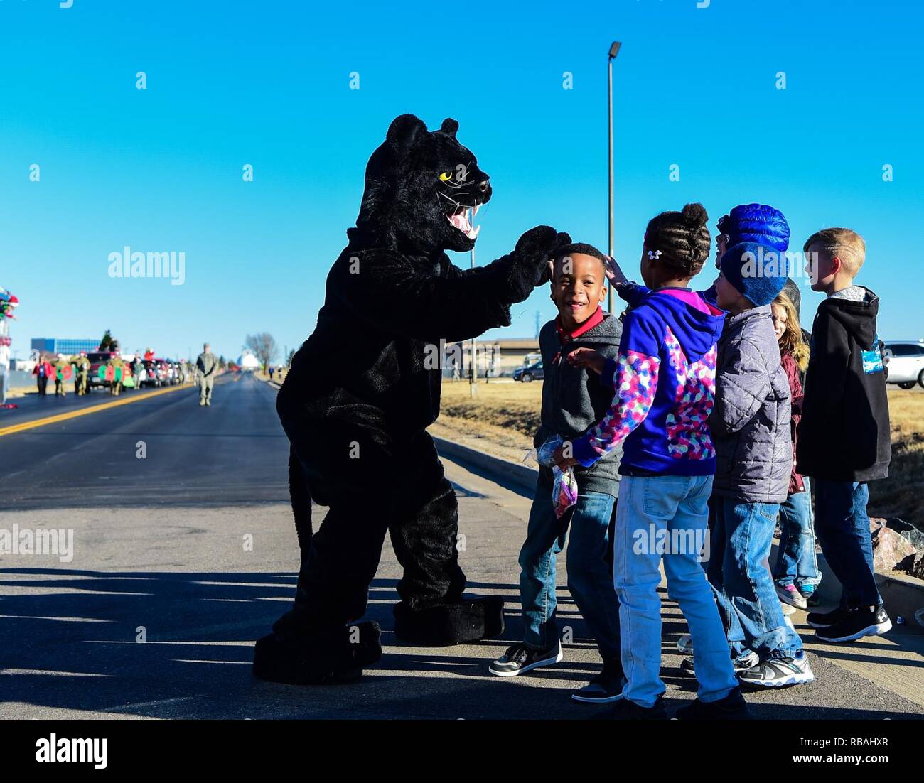 Buck Lee, 460th Space Wing mascot, greets children with a high-five ...