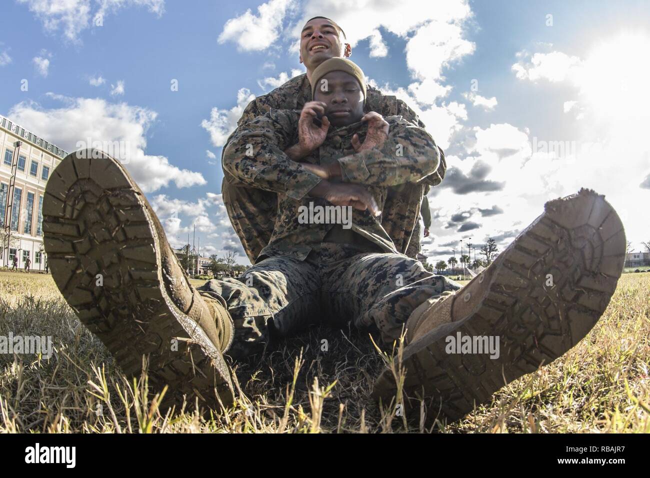 A Marine with Marine Forces Reserve picks up another Marine to buddy ...