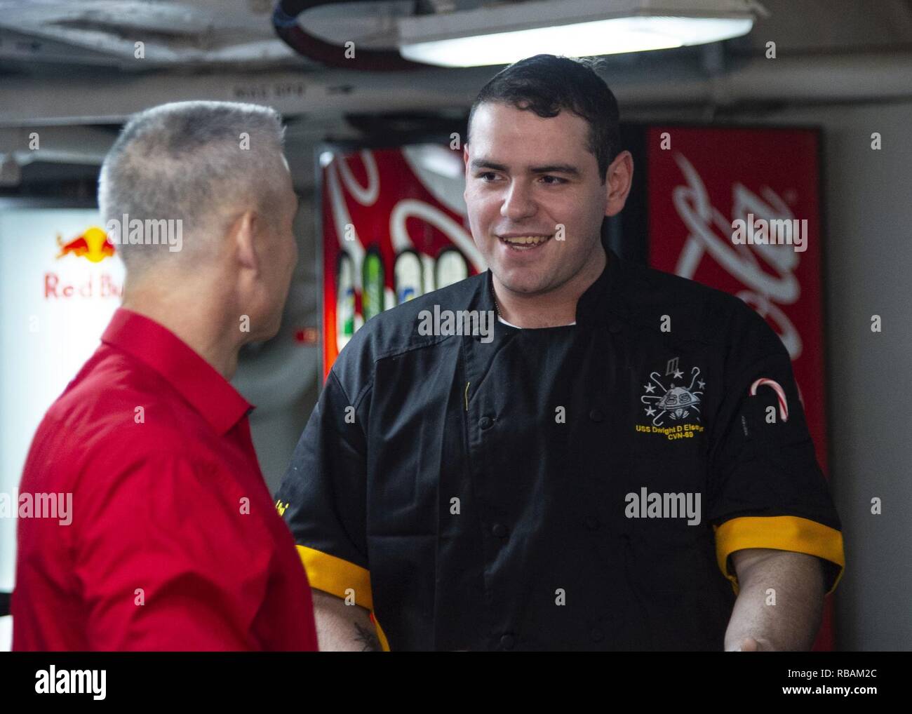 NORFOLK, Va. (Dec. 25, 2018) Capt. Kyle P. Higgins, left, commanding ...