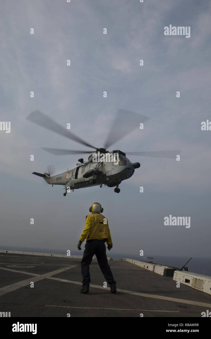 U.S. Navy Sailor ABH3, Eddie Delacruz, an aviation boats mate handler ...
