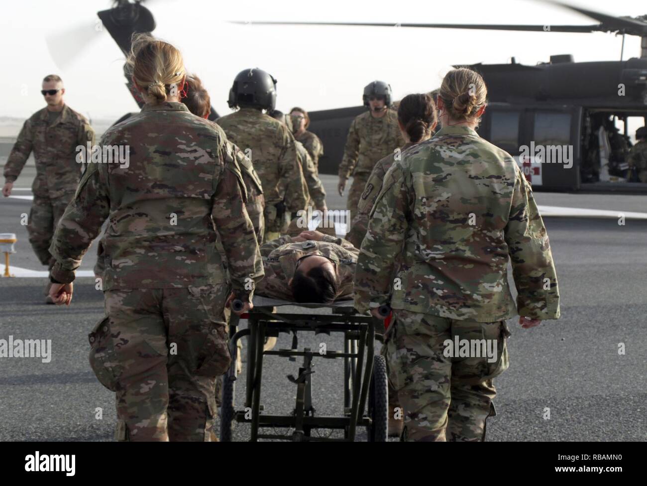 Soldiers of 452d Combat Support Hospital carry a mock casualty for hot ...