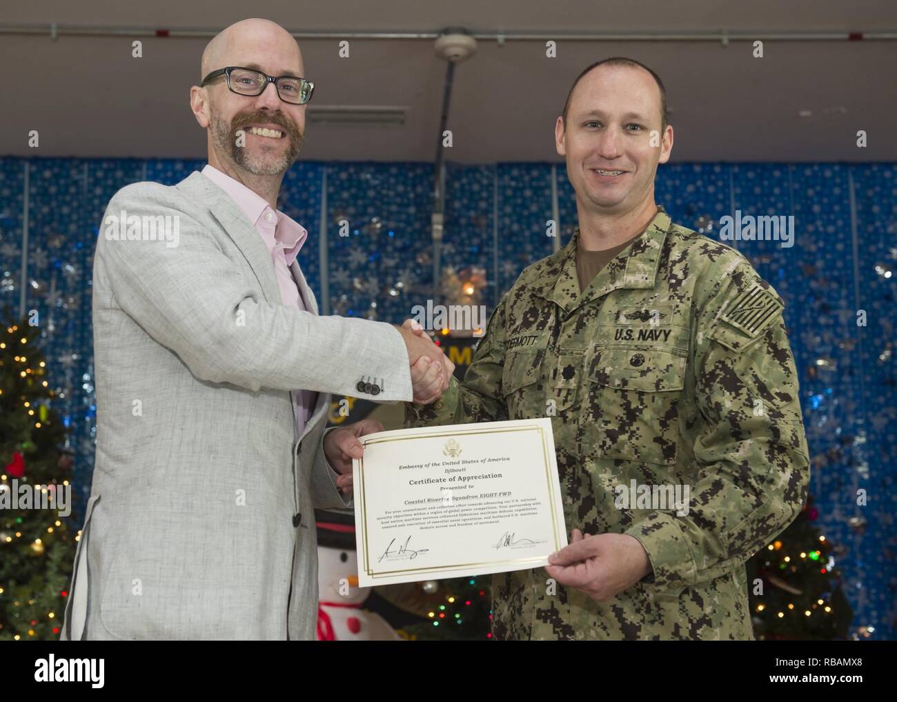 CAMP LEMONNIER, Djibouti - U.S. Navy Cdr. Eric T. McDermott (right ...