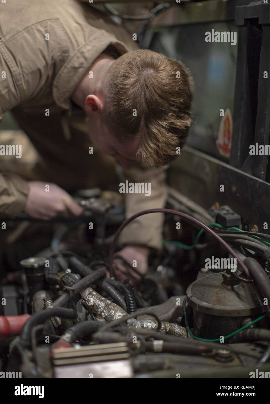 Corporal Michael Hill, an automotive maintenance technician with ...
