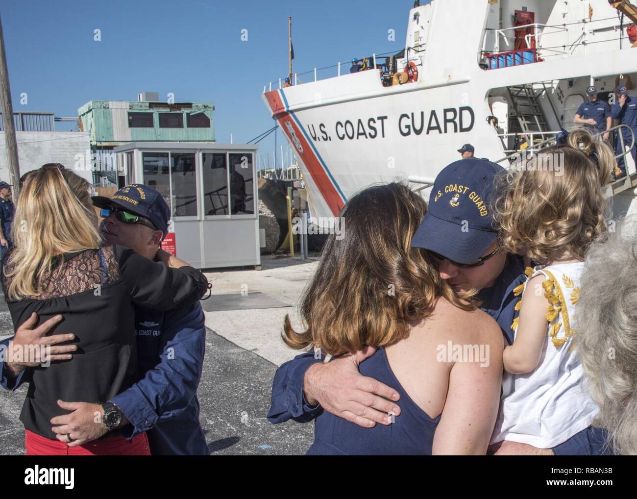 Crewmembers aboard the Coast Guard Cutter Resolute are greeted Monday ...