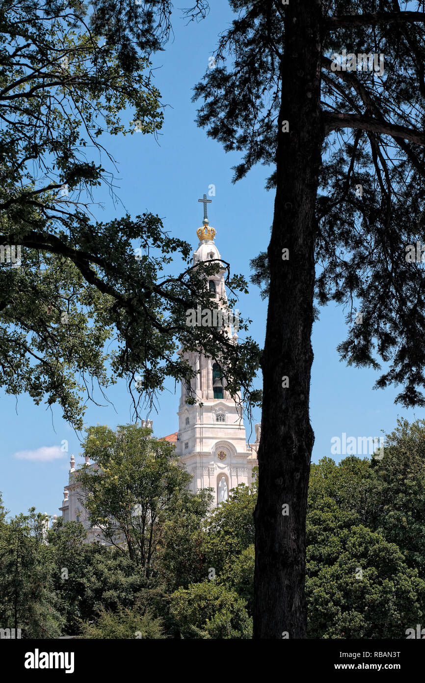 Tower of Fatima shrine, world catholic atlar, between trees Stock Photo ...