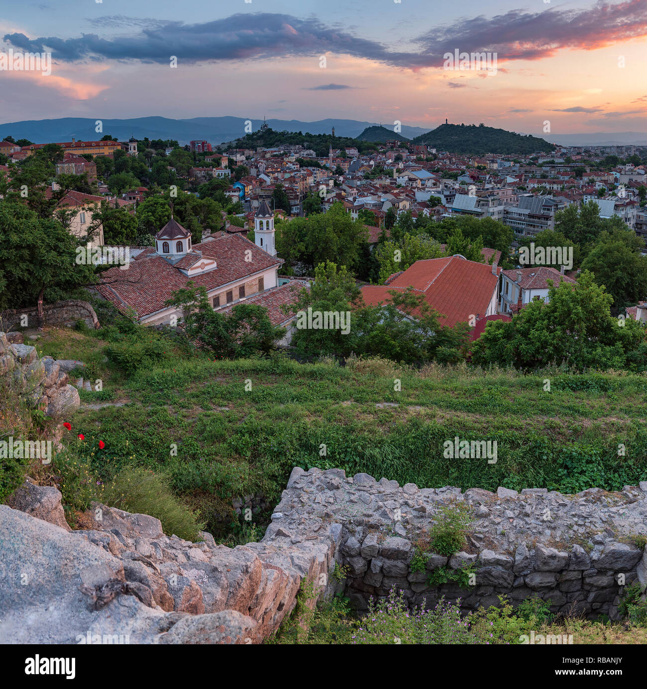 sunset over Plovdiv city, photo from one of the hills with ancient ...