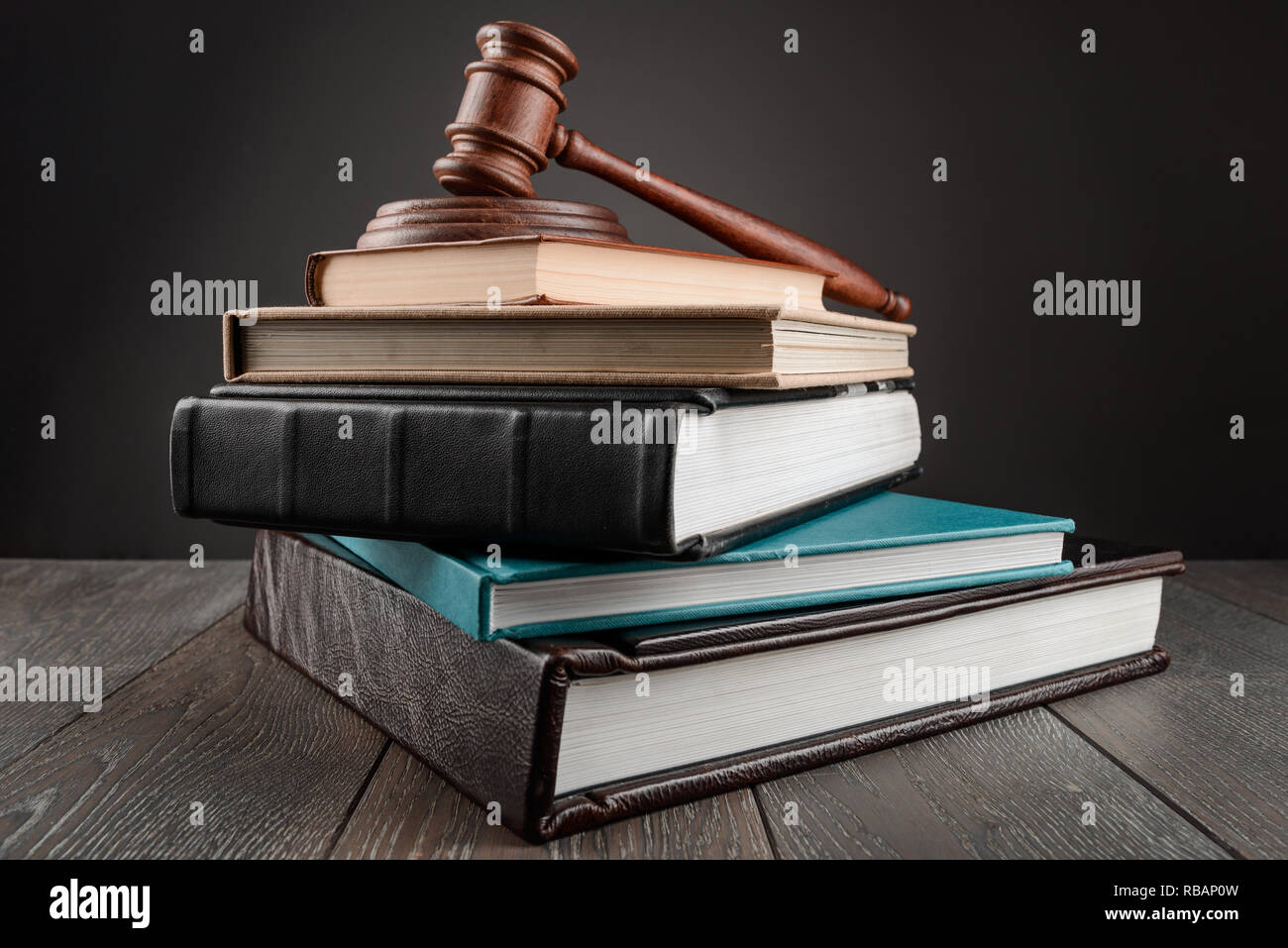 Gavel on top of books Stock Photo - Alamy