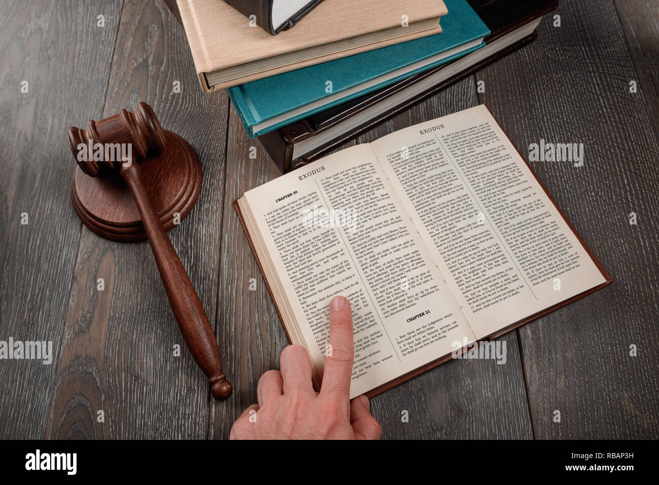 Judge reading book of Exodus Stock Photo - Alamy
