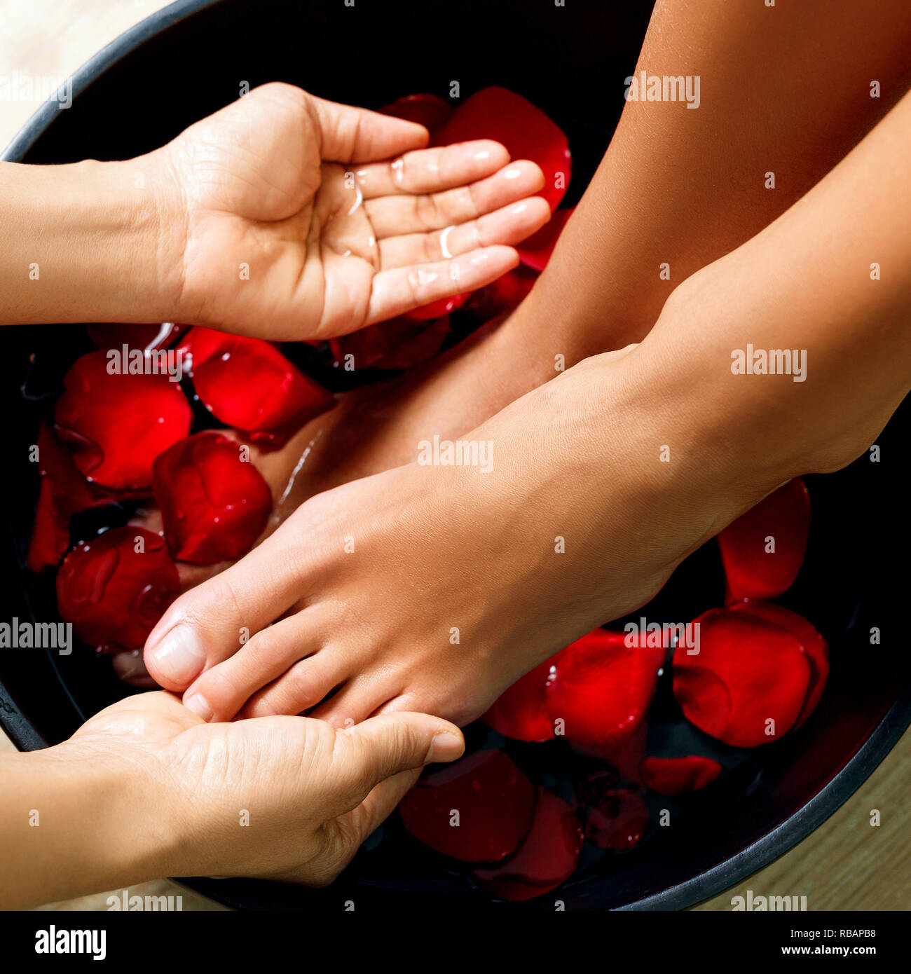 Foot washing in the spa salon. Legs massage concept. Feet spa Stock ...