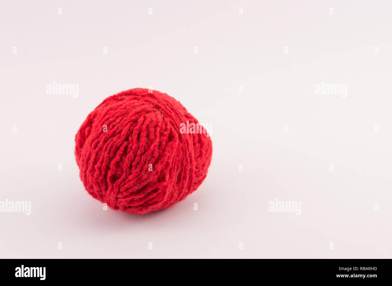 wool balls still life on a white surface Stock Photo - Alamy