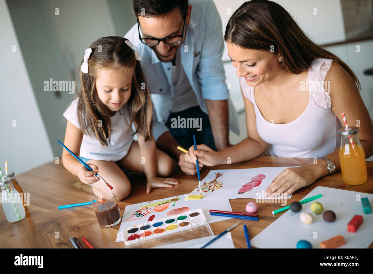 Happy family having fun time at home Stock Photo - Alamy