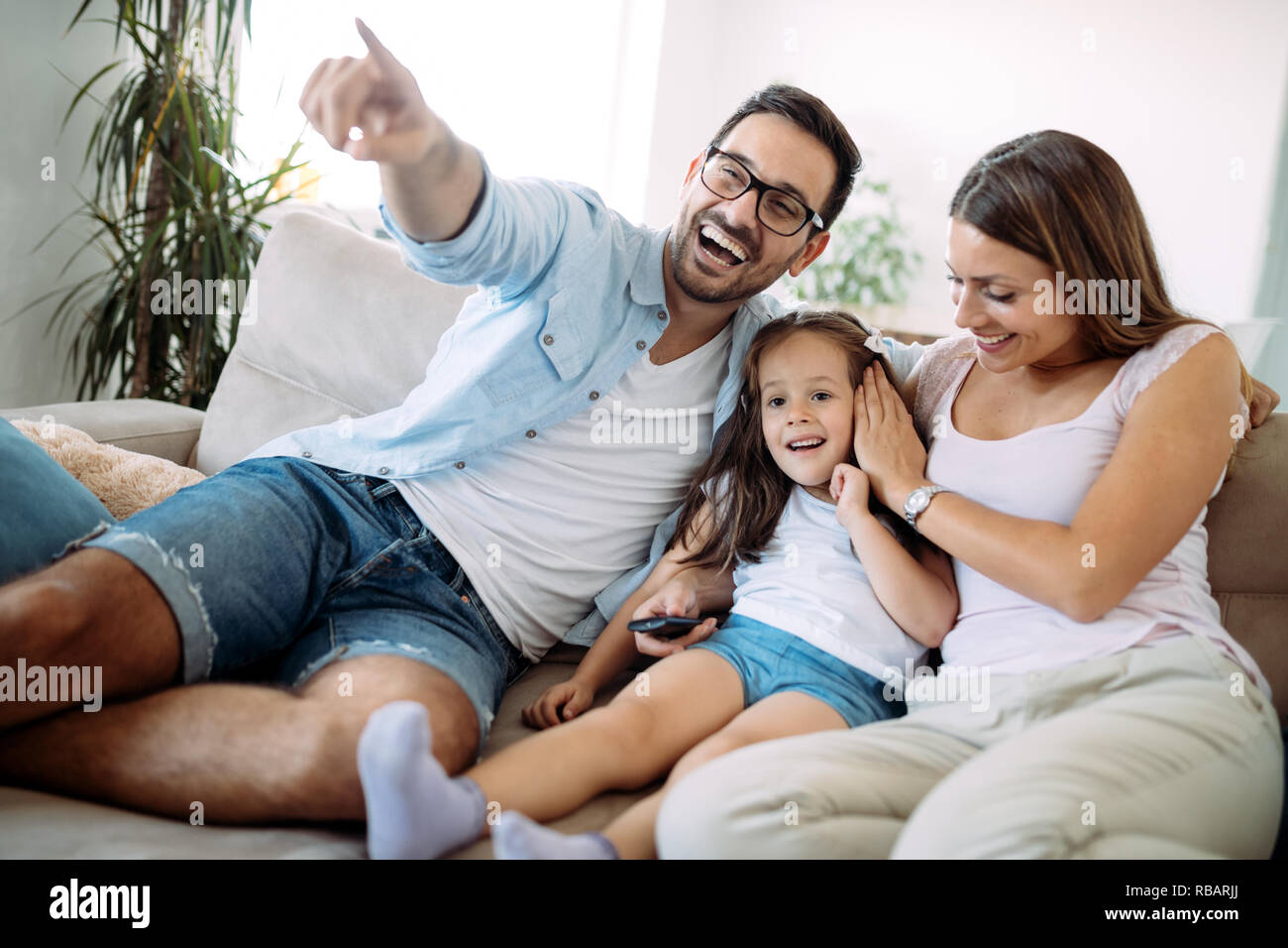 Happy family having fun time at home Stock Photo - Alamy