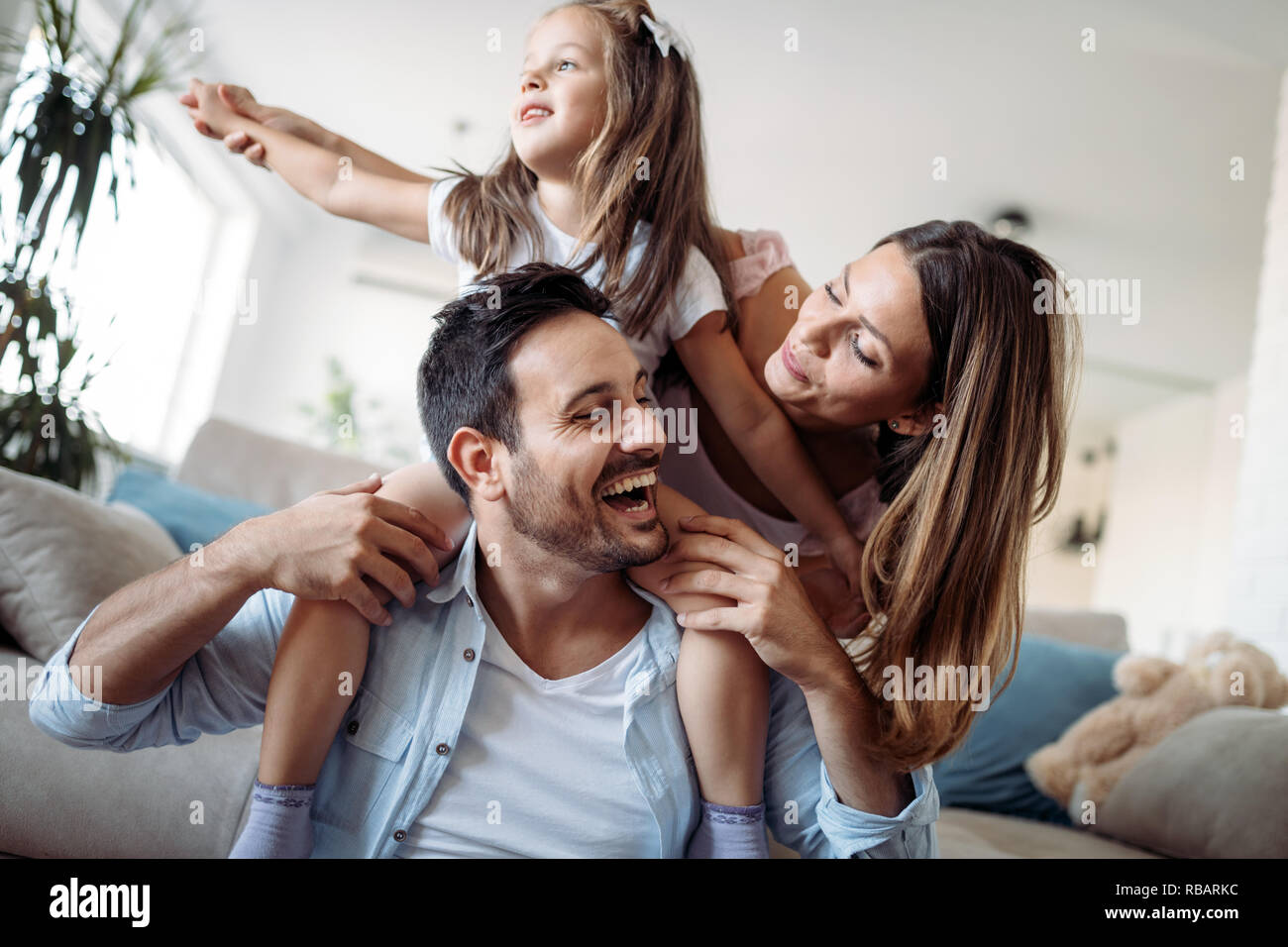 Happy family having fun time at home Stock Photo - Alamy