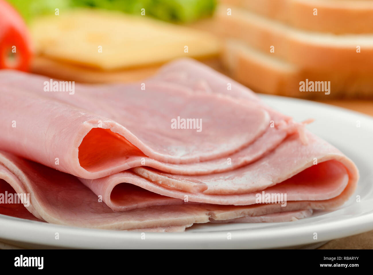 Thin slices of ham Stock Photo - Alamy