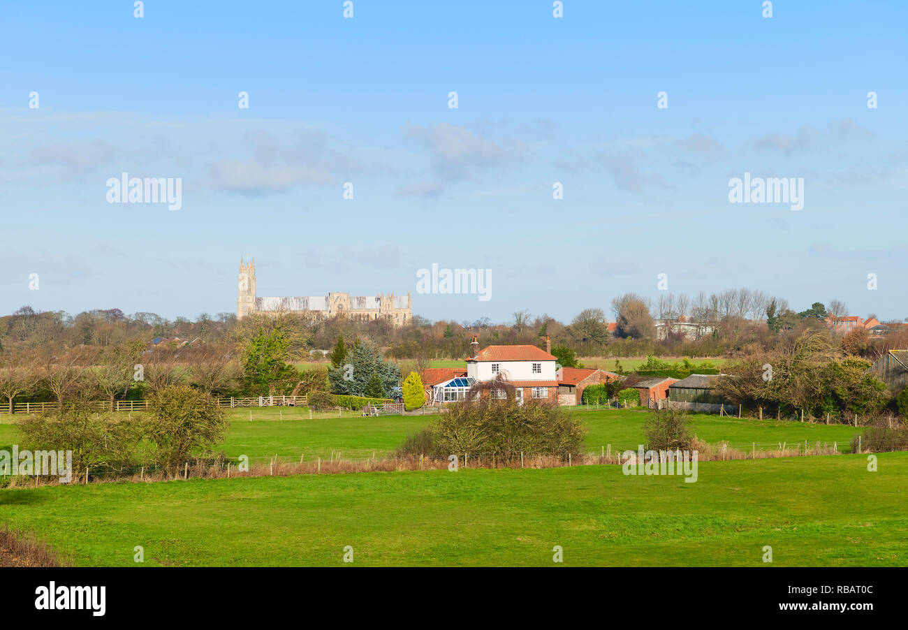 View of rural landscape with farmland and trees with the Minster on the ...