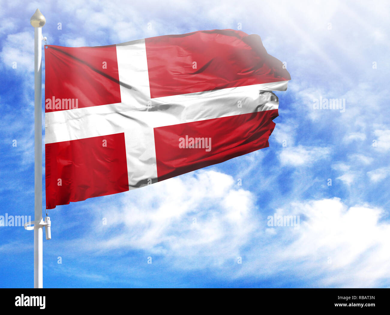 National flag of Denmark on a flagpole in front of blue sky Stock Photo ...