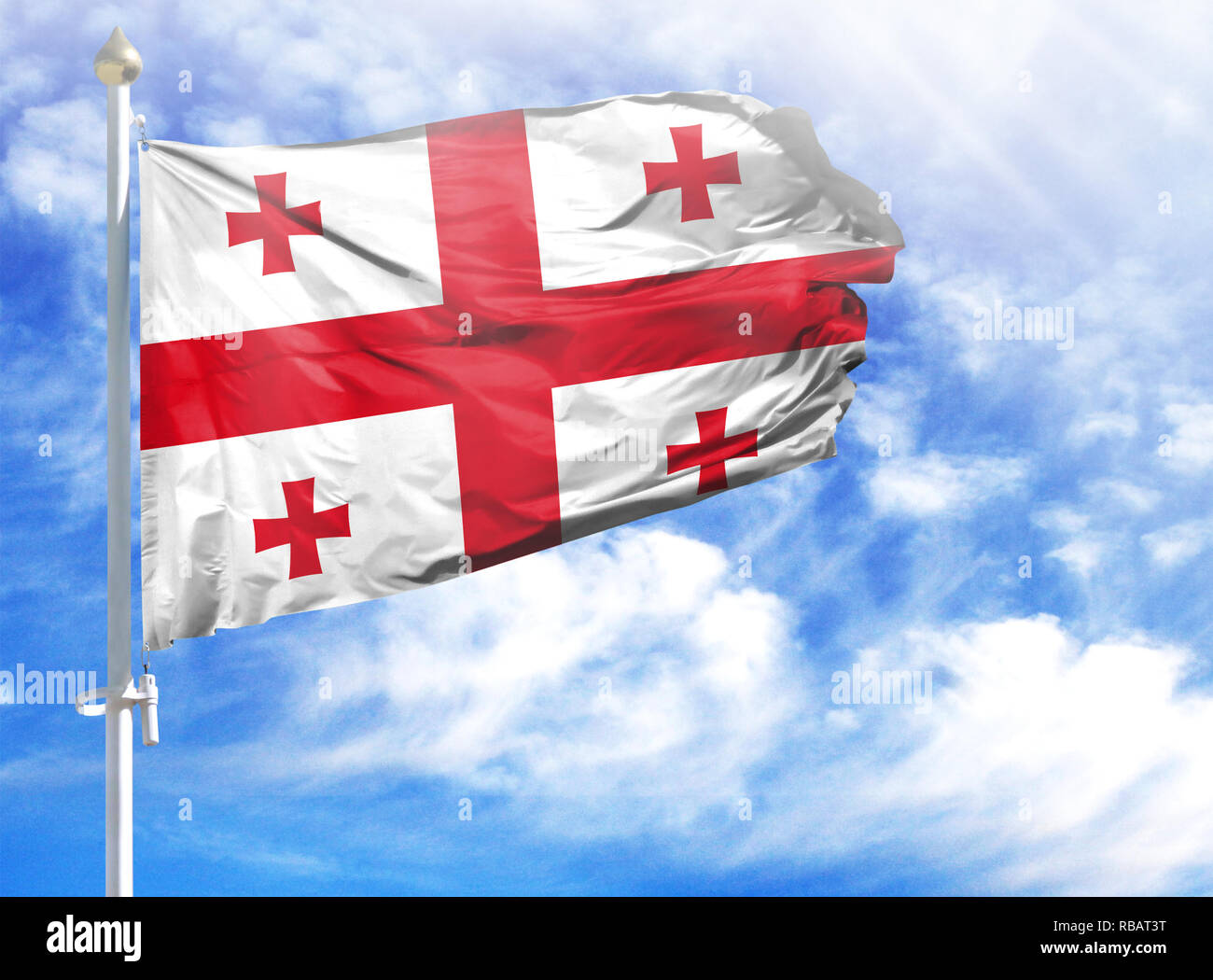 National flag of Georgia on a flagpole in front of blue sky Stock Photo ...