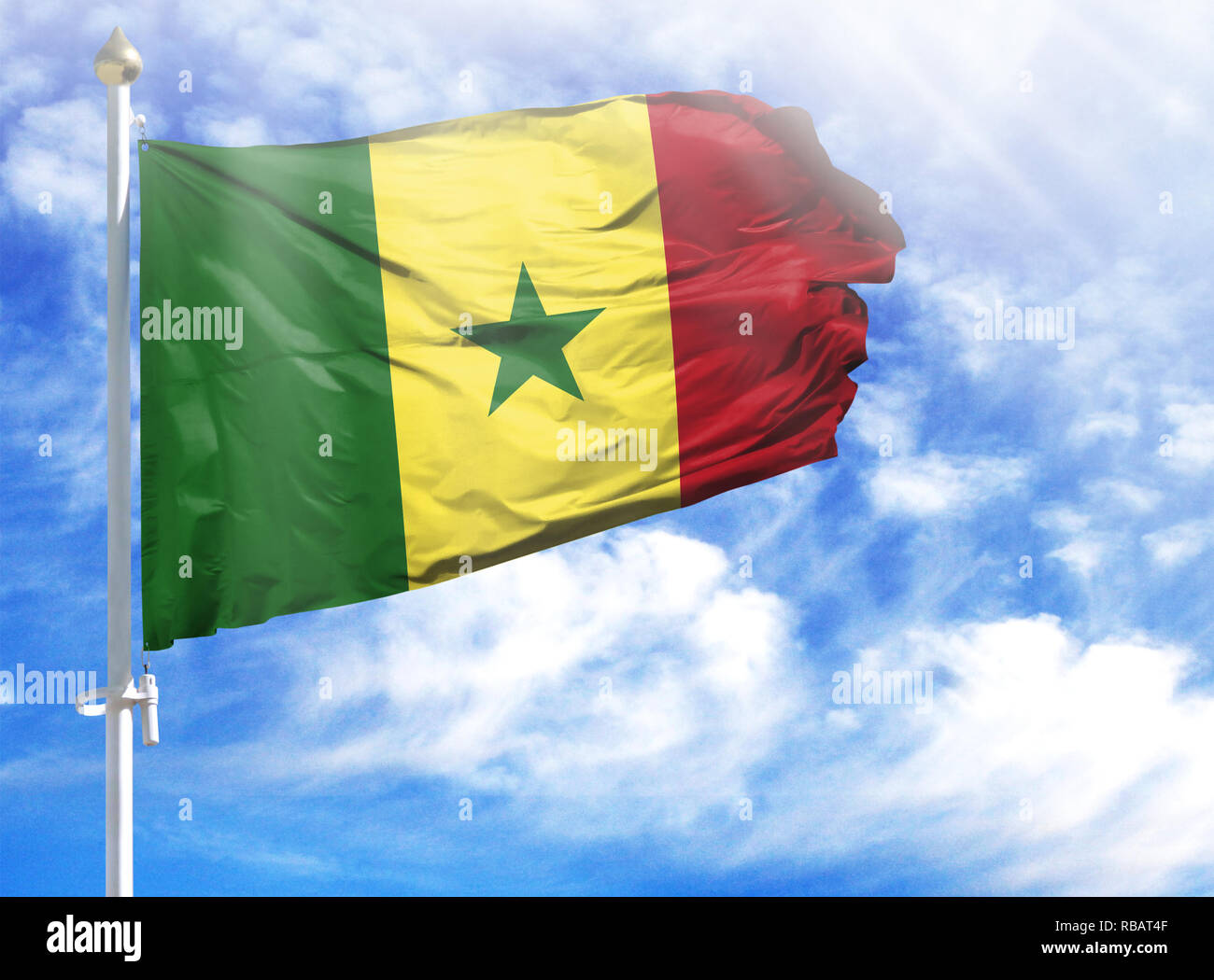 National flag of Senegal on a flagpole in front of blue sky Stock Photo ...