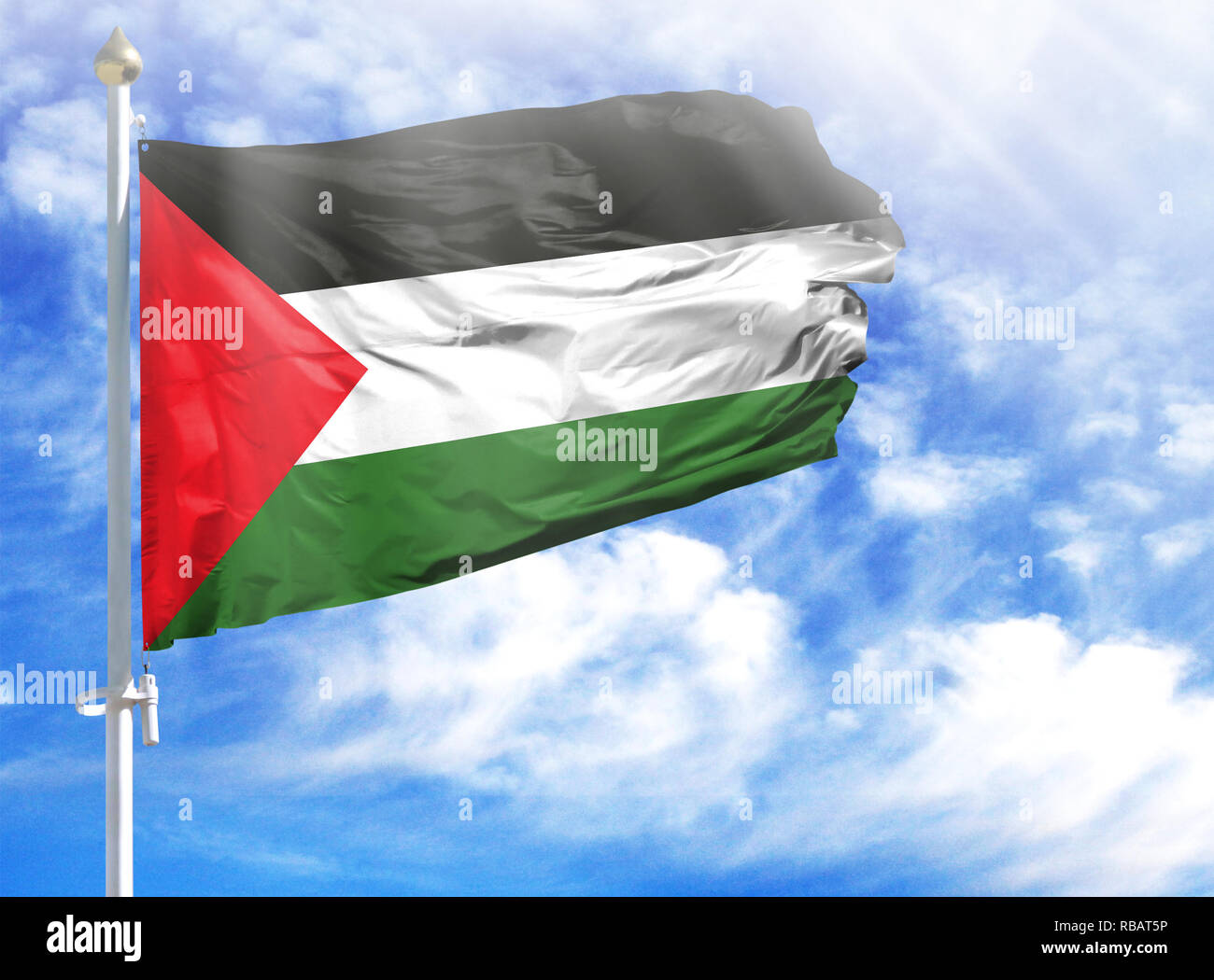 National flag of Palestine on a flagpole in front of blue sky Stock ...