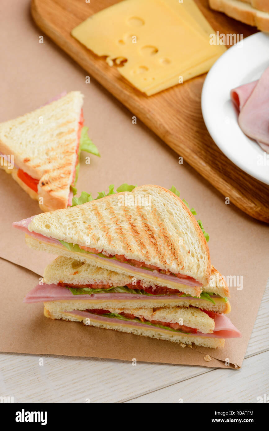 Making grilled sandwich triangles Stock Photo - Alamy