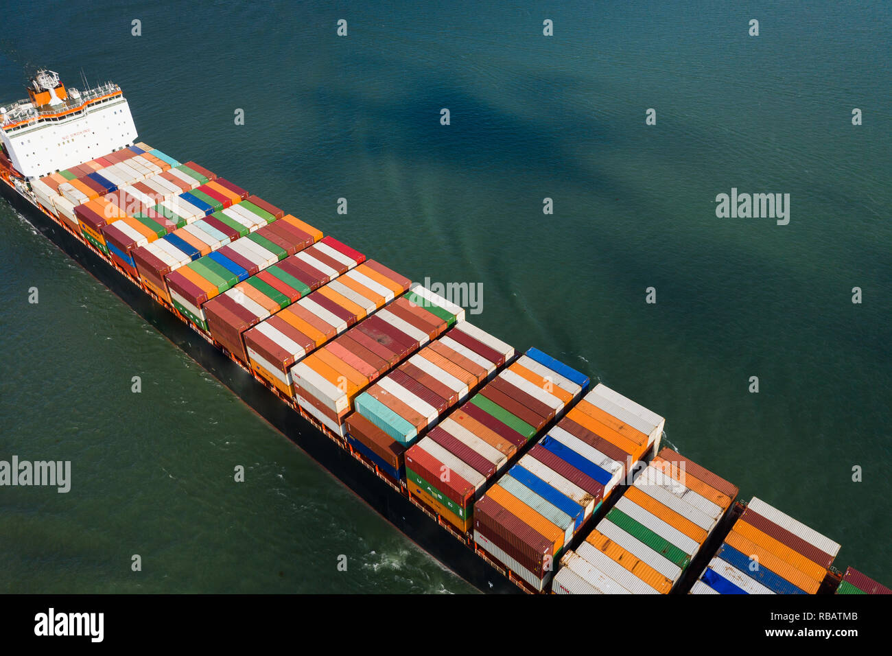 Aerial view of a container ship going upstream in the St. Lawrence ...