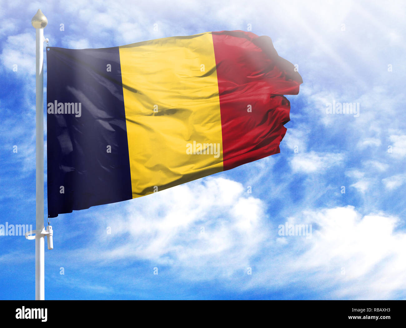 National flag of Chad on a flagpole in front of blue sky Stock Photo ...