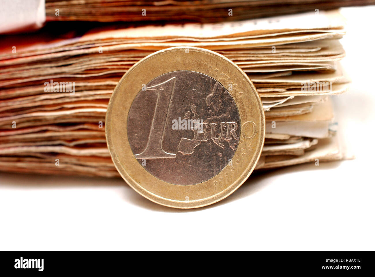 one euro coin on a banknote background, image of a Stock Photo - Alamy