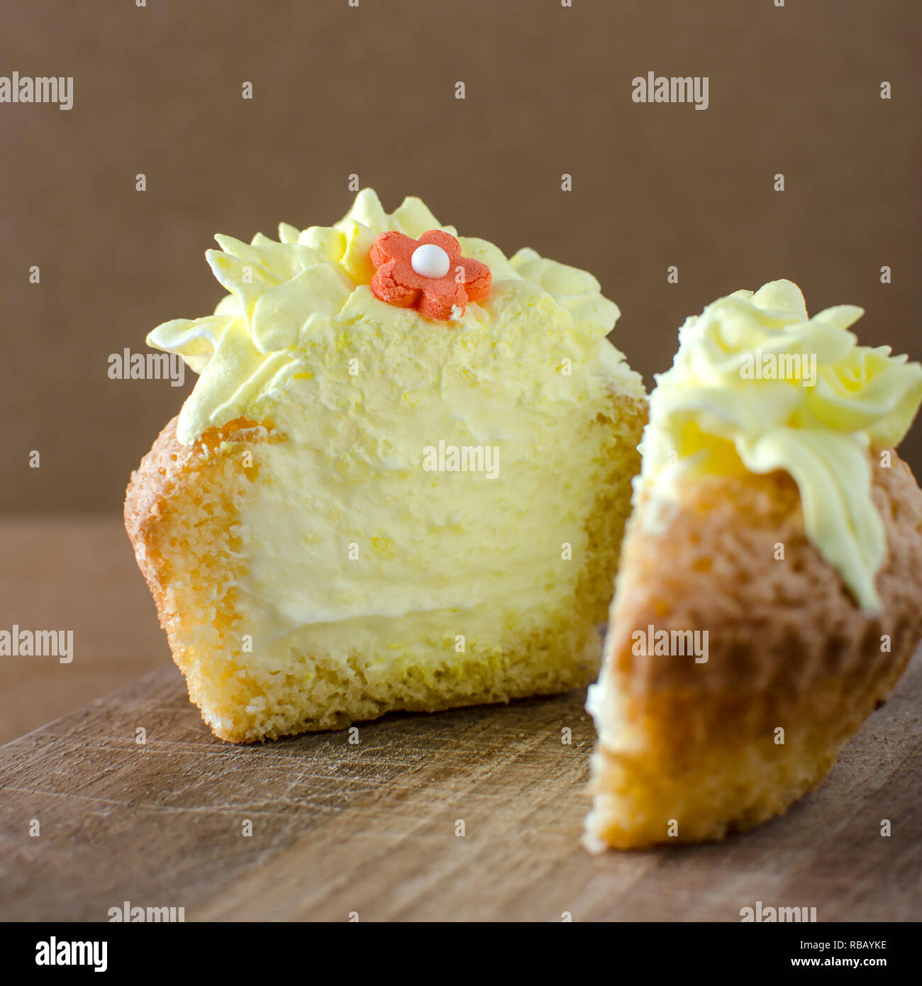 Cupcake stuffed with cream, close up Stock Photo - Alamy