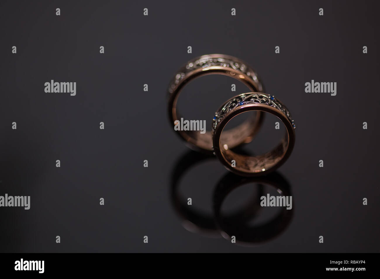 Two wedding rings in infinity sign. Love concept Stock Photo - Alamy