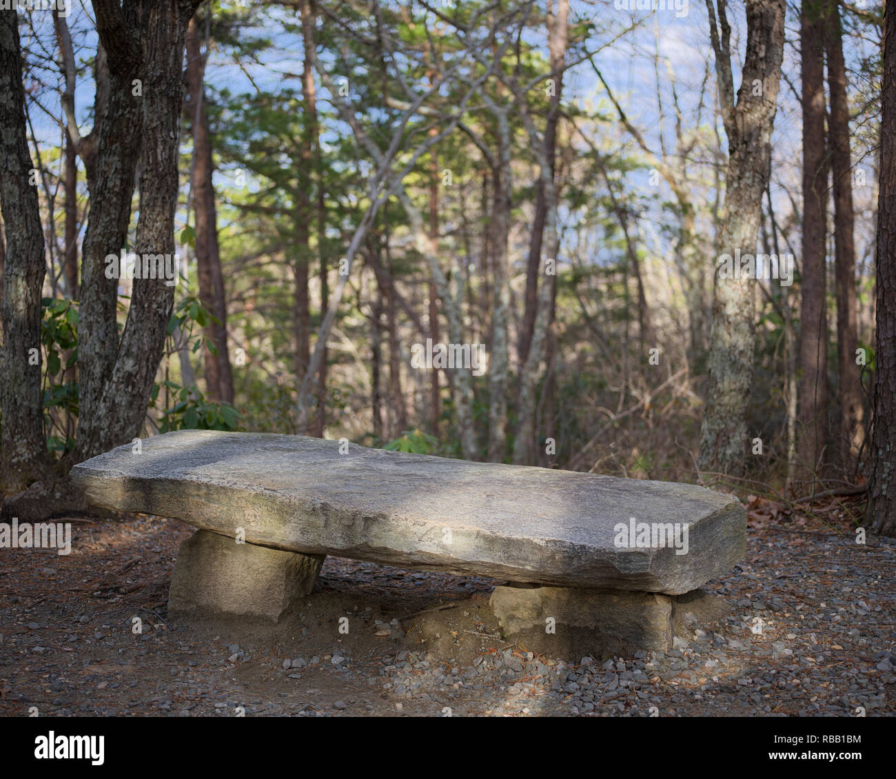 Rock bench along trail to upper cascade waterfall at Hanging Rock State ...