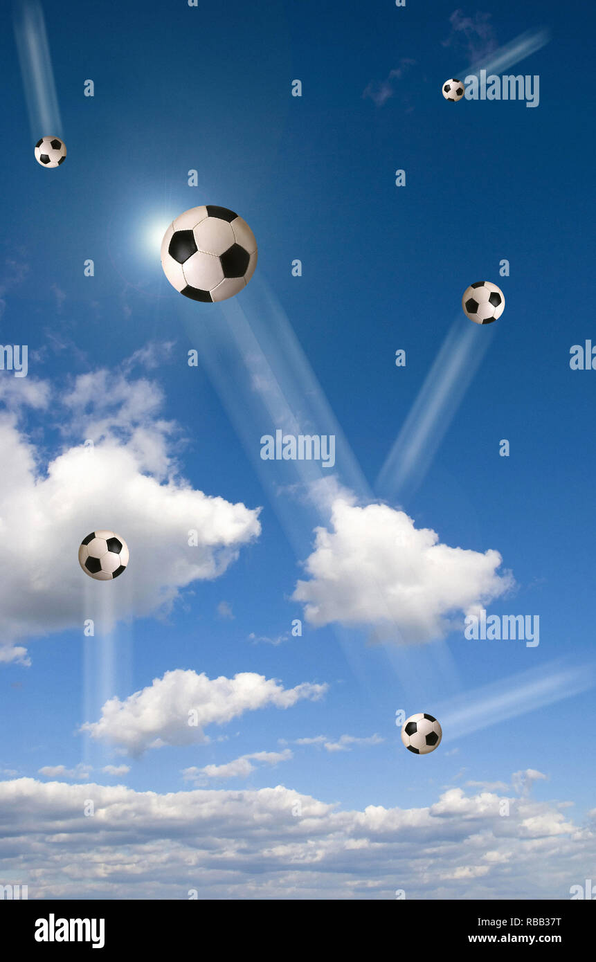 many football balls flying in the blue sky Stock Photo - Alamy