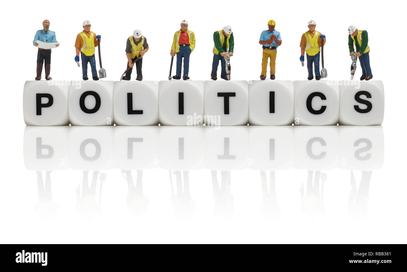 Construction workers and the word Politics Stock Photo - Alamy