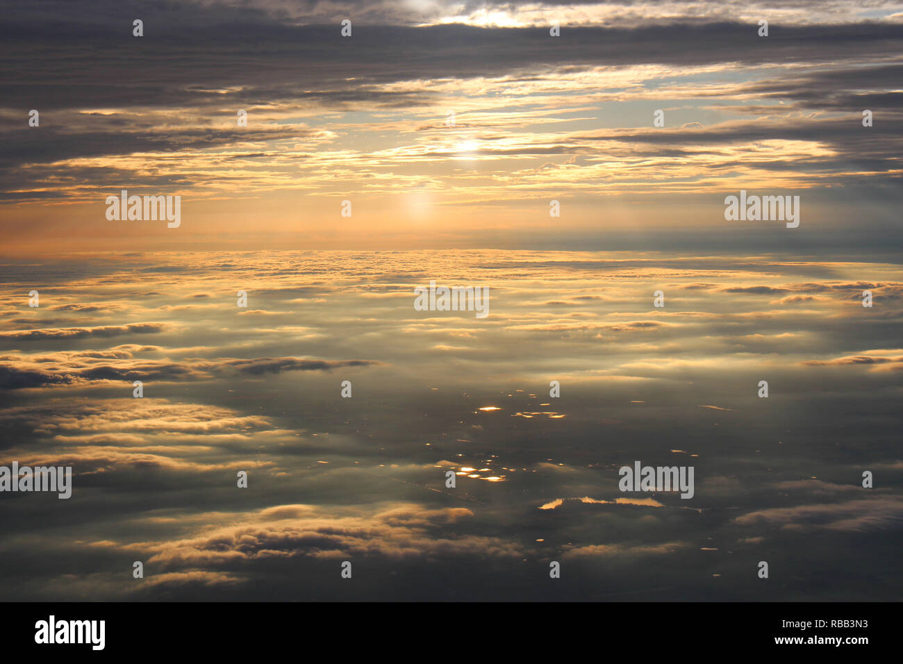 Aerial shot of a sunset with beams of light streaming through ...