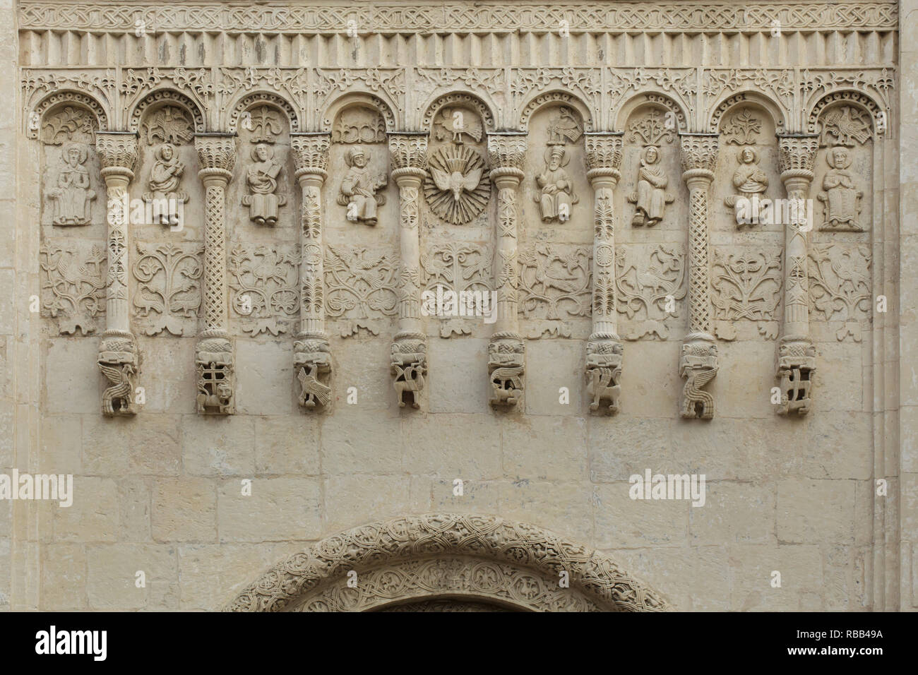 Medieval white-stone carved blind arcade dated from the 12th century on ...