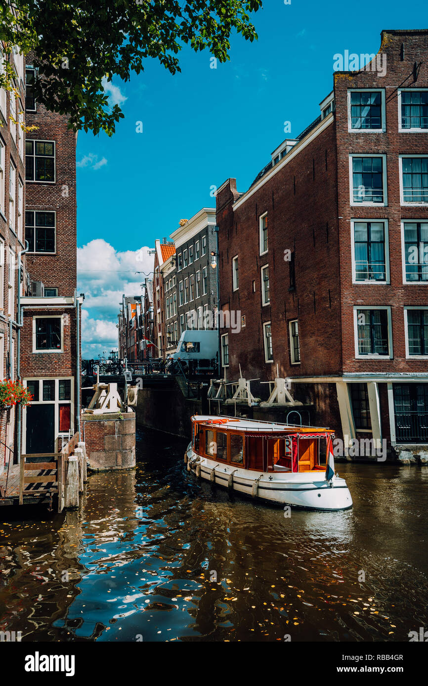 Small Tourist boat floating picturesque dutch channel passing ...