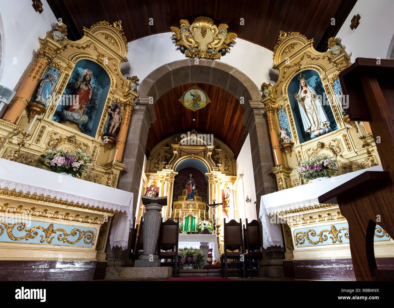 View of the main altarpiece and side altars of the Baroque Church of ...