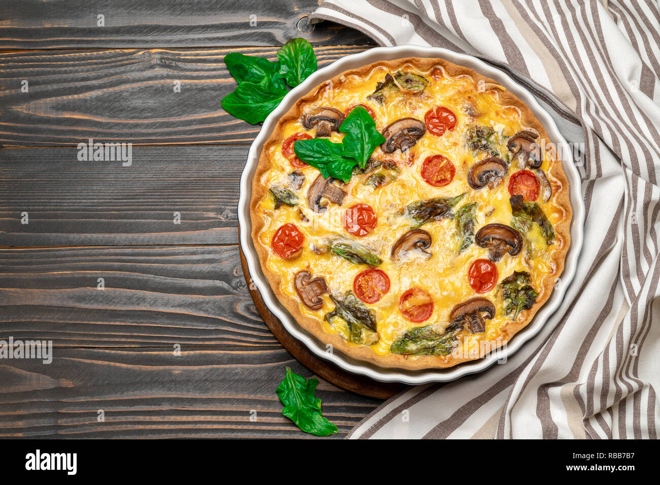 Baked homemade quiche pie in ceramic baking form Stock Photo - Alamy