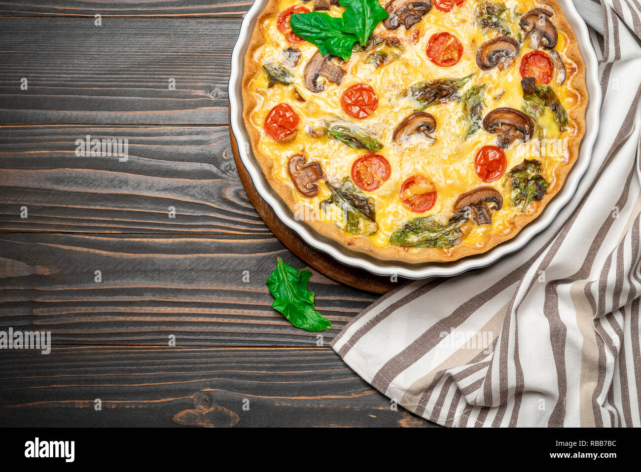 Baked homemade quiche pie in ceramic baking form Stock Photo - Alamy